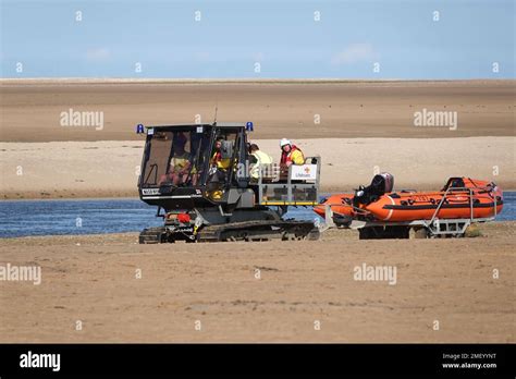A Beach Tractor Towing A Rnli Royal National Lifeboat Institute Rib