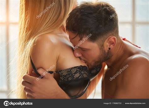 Man Kissing Womans Breast Stock Photo By Denisfilm 176982722