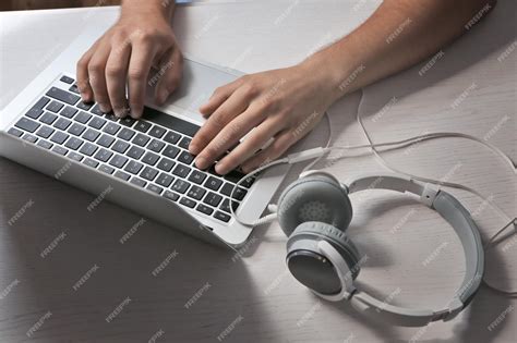 Premium Photo Male Hands Typing On Laptop In Office