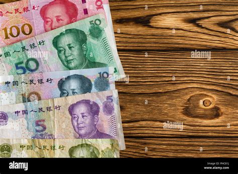 Side Border Of Chinese Yuan In Different Denominations Arranged In An