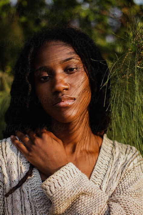 Portrait Of A Black Girl With Dreads During Golden Hour Del