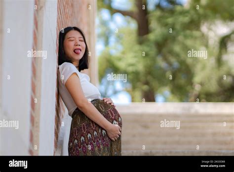 Young Happy And Beautiful Asian Japanese Woman Posing Outdoors Happy And Cheerful Pregnant