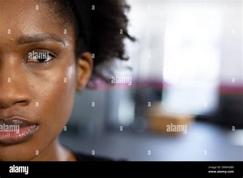 Close Up Half Face Portrait Of African American Fit Woman Alone At Gym