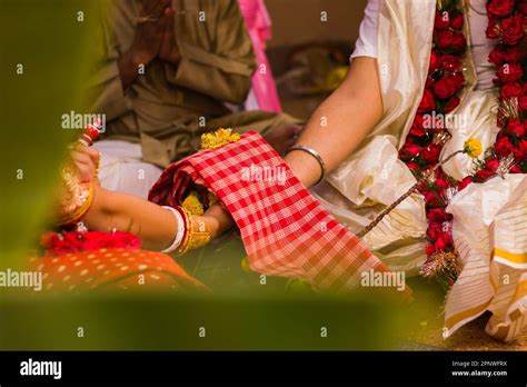 Hindu Bengali Marriage Ritual Being Performed By Bride And Groom During