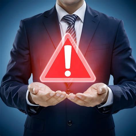 Businessman Holds Holographic Red Warning Sign Emphasizing Modern Tech