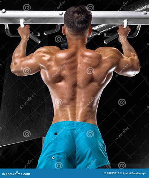 Young Handsome Guy Doing Exercises In The Gym Stock Image Image Of