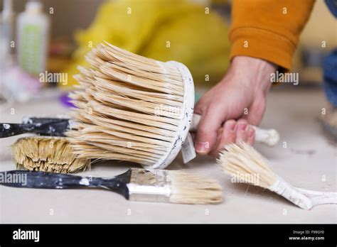 Preparing To Paint The Wall Detail Of Man S Hand Painting The Walls Of New Home Stock Photo Alamy