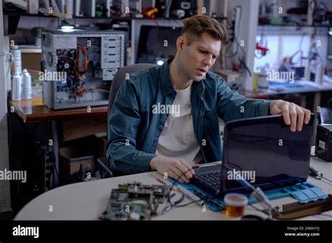 Caucasian Professional Technician Sit Thinking How To Repair Fault