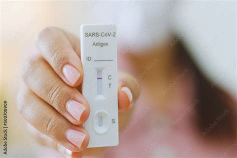 Young Asian Woman Using Rapid Antigen Test Kit Atk For Self Test At