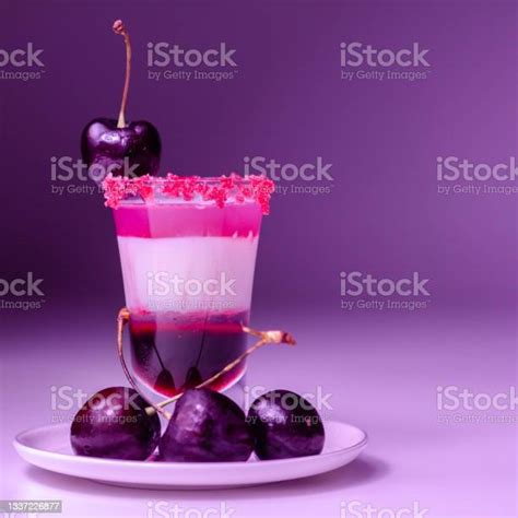 Threelayer Cocktail Based On Vodka Cherry Liqueur And Syrup In Drink Shot Glass Decorated With