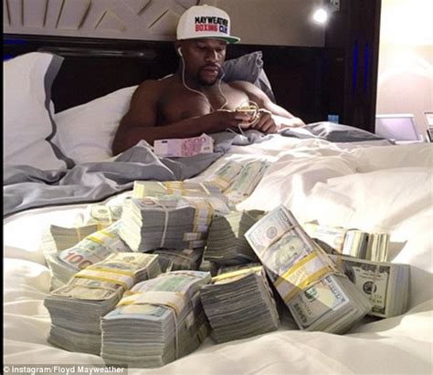 Floyd Mayweather Shows Off Fortune With Stacks Of 100 Bills Covering