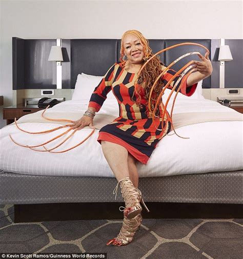 Nail Artist Spends 23 Years Growing The Worlds Longest Fingernails