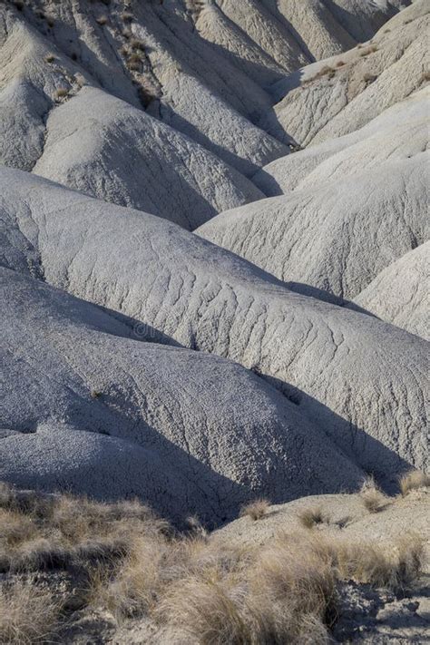 Vertical Photograph Of The Winding Arid And Desert Landscape Of
