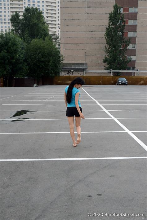 Cute Oriental Girl Ainura Barefoot In A Dirty Parking Part 1 Of 6