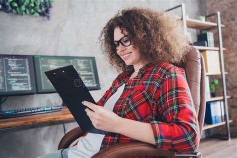 Young Professional Woman Working Remotely As A Programmer In A Stylish