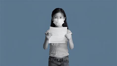 Premium Photo Young Asia Girl Wearing Medical Face Mask Shows