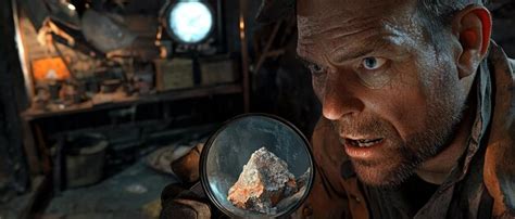 Miner Examining A Piece Of Ore Premium Ai Generated Image