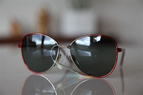 Grading Metallic Red Tortoise Frame With Dark Polarizing Lenses From