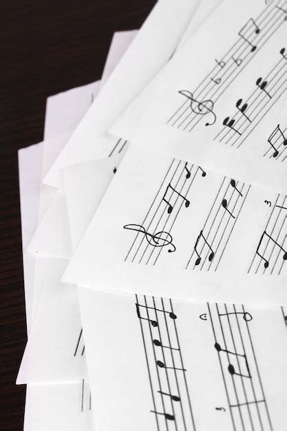Premium Photo Musical Notes On Wooden Table