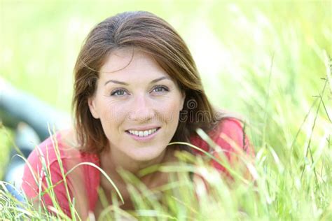 Happy Woman Lying In Grass Smiling Stock Photo Image Of Relaxing
