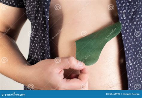 Anti Inflammatory And Analgesic Patch In A Man On His Stomach Treating