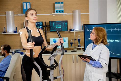 Doctor Observes The Progress Of A Female Athlete As She Performs