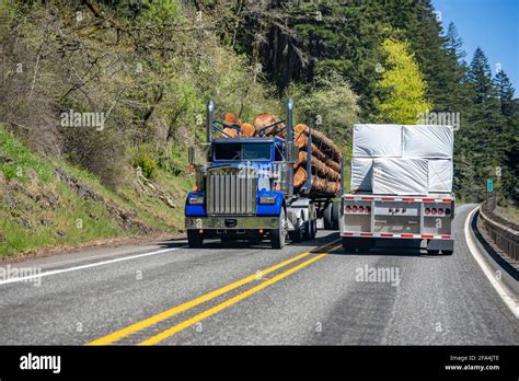 Different Classic Loaded Big Rigs Semi Trucks With Semi Trailers Moving
