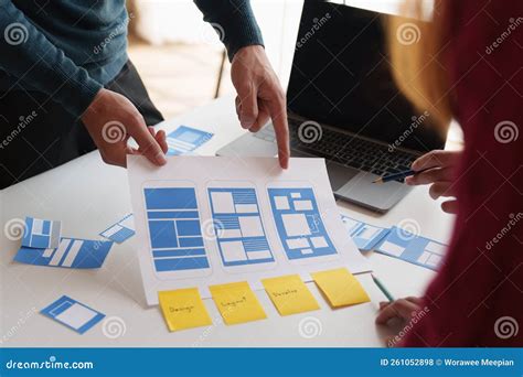 Group Of Ux Developer And Ui Designer Brainstorming About App Interface Design At Modern Office