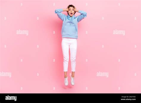 Full Length Photo Of Impressed Lady Jumping Dressed Blue Clothes Arm