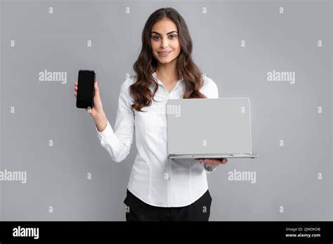 Happy Girl Using Mobile Phone And Laptop Woman Showing Empty Laptop