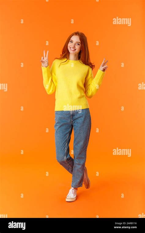 Vertical Full Length Cute Lovely Redhead Teenage Girl In Jeans And