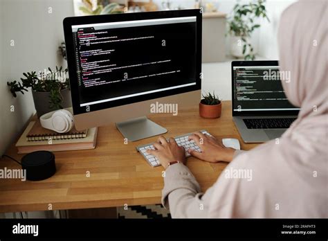 Hands Of Young Muslim Female It Engineer Typing On Computer Keyboard While Sitting By Workplace