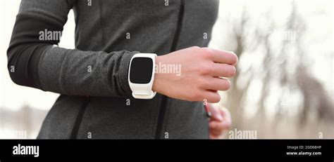 Sports smartwatch woman running using wearable technology during ...