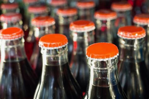 Premium Photo Soft Drinks In Bottles Background