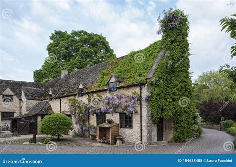 Narrow Lane With Romantic Thatched Houses And Stone Cottages In The