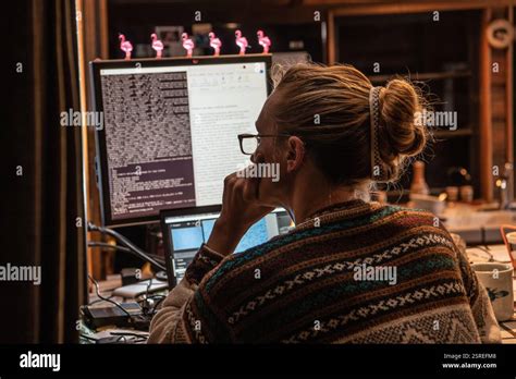 A Woman Programming And Running Code Working Late From Home Stock Photo Alamy