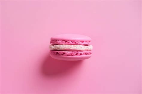 Single Macaron Set Against Soft Pastel Background Offering Space For