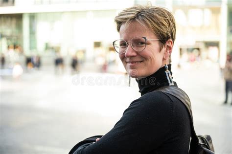 Outdoor Portrait Of A 36 Yo Short Haired White Woman Wearing A Black