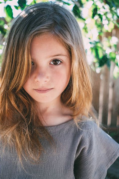 Portrait Of Young Girl Modeling Stylish Clothes By Stocksy
