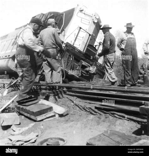 Repair Workers Gather Around A Derailed Railroad Train Ca 1948 Stock