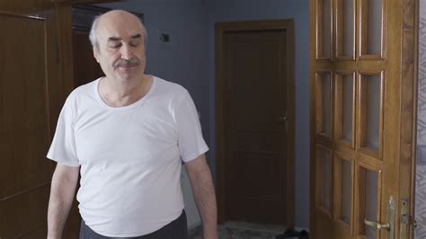 Bored Old Man Walking Alone At Home The Unhappy Old Man Lives Alone At