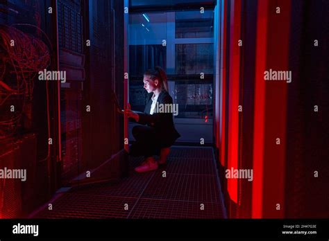 Female System Manager Configuring Servers In Server Room Stock Photo Alamy