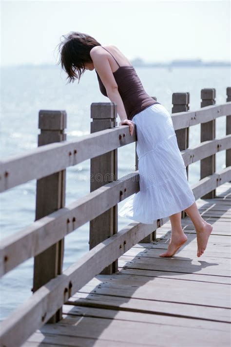 Girl Looks Over Railing Picture Image 10015757