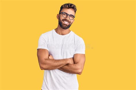 Young Hispanic Man Wearing Casual Clothes And Glasses Happy Face