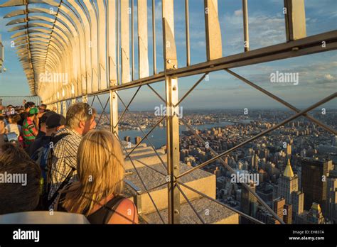 Tourists At The Empire State Building Viewing Platform Enjoying The