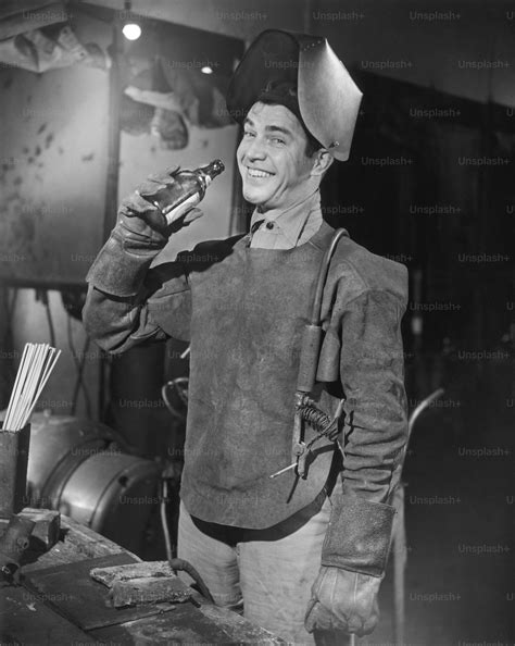 United States Circa 1950s Welder Enjoying Beer Break At Foundry
