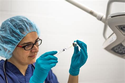 Premium Photo Doctor Holding Injection At Clinic
