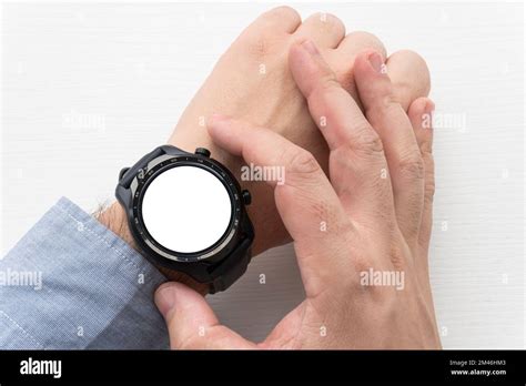 Fitness Watch On Mans Forearm Showing Date Time Heart Rate And Step