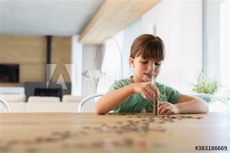 Free Girl Counting And Stacking Coins At Dining Table Nohat Cc
