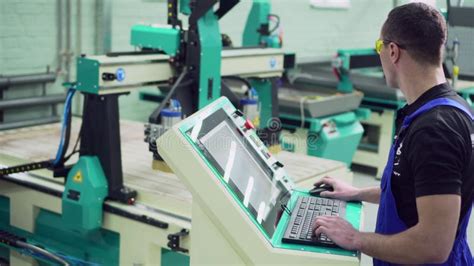 A Male CNC Machine Operator Is Typing On The Control Panel Stock Footage Video Of Technology
